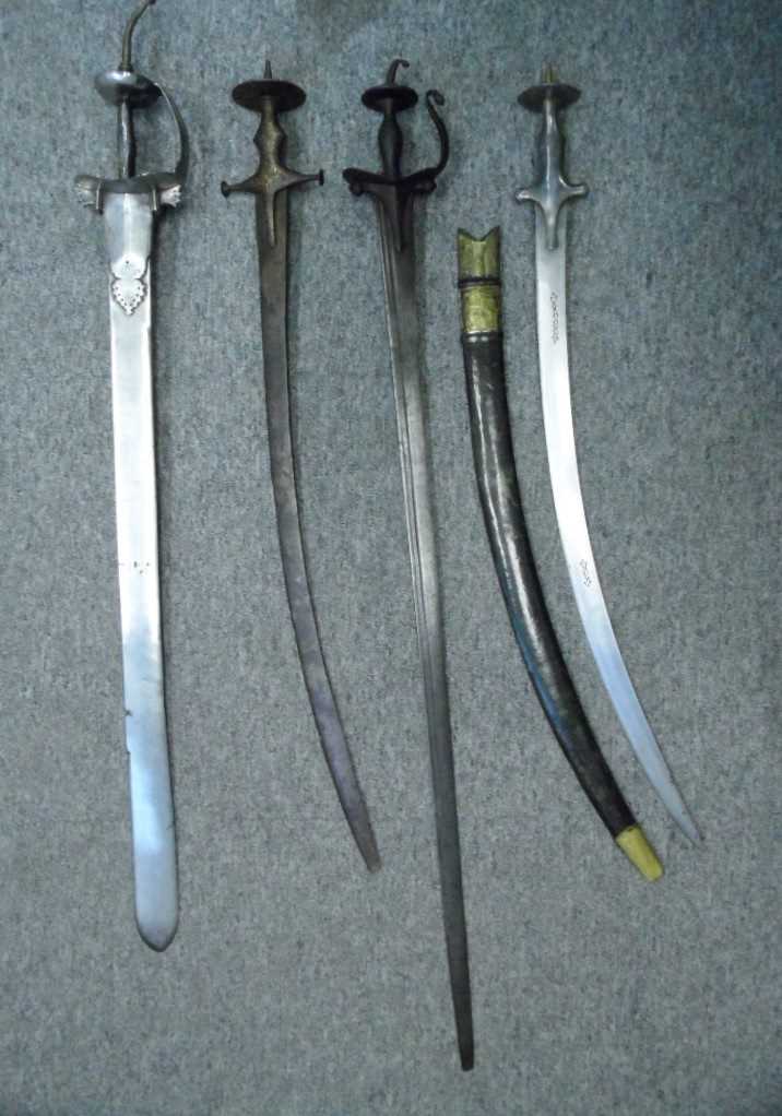 Lot 63 - TWO INDIAN SWORDS (KHANDA) AND TWO FURTHER