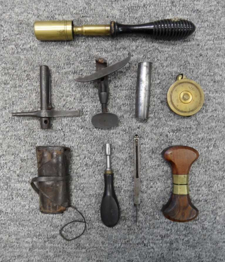 Lot 150 - A PERCUSSION TOOL IN ITS LEATHER POUCH