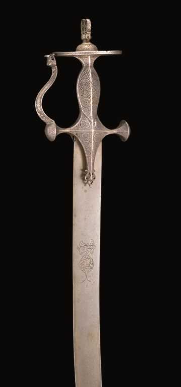 Lot 21 - AN FINE INDIAN SILVER-HILTED TALWAR