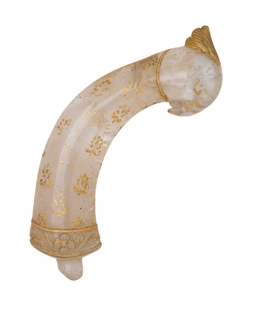 Lot 36 - AN INDIAN CARVED ROCK CRYSTAL DAGGER HILT