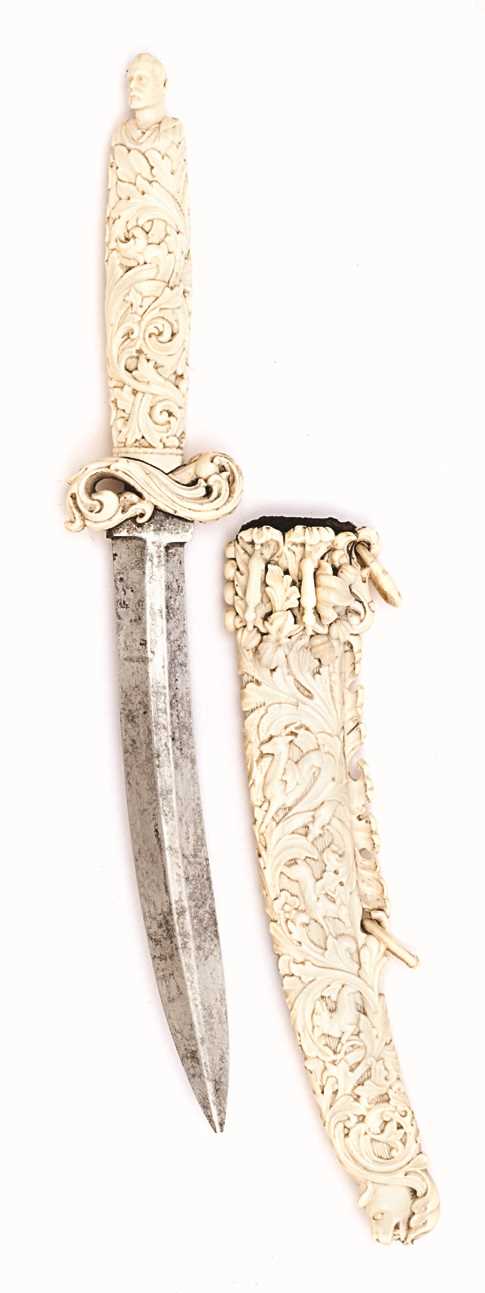 Lot 159 - A FINELY CARVED IVORY-MOUNTED DAGGER