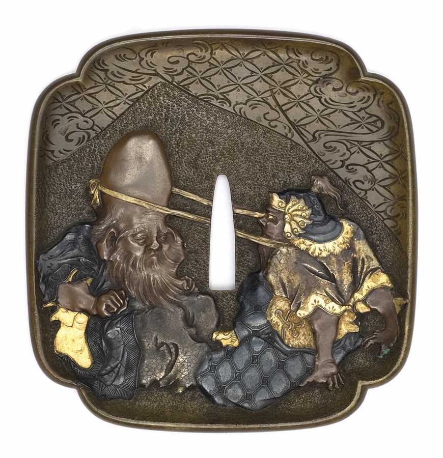 Lot 6 - **A JAPANESE BRASS MOKKO TSUBA