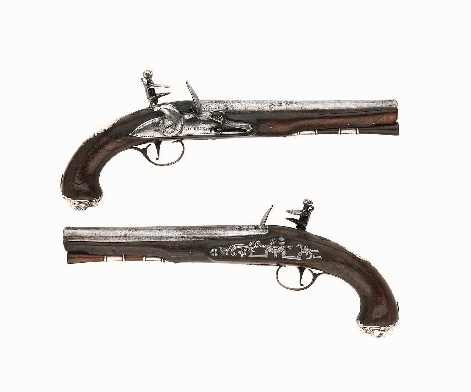 Lot 538 - A PAIR OF SILVER-MOUNTED FLINTLOCK PISTOLS