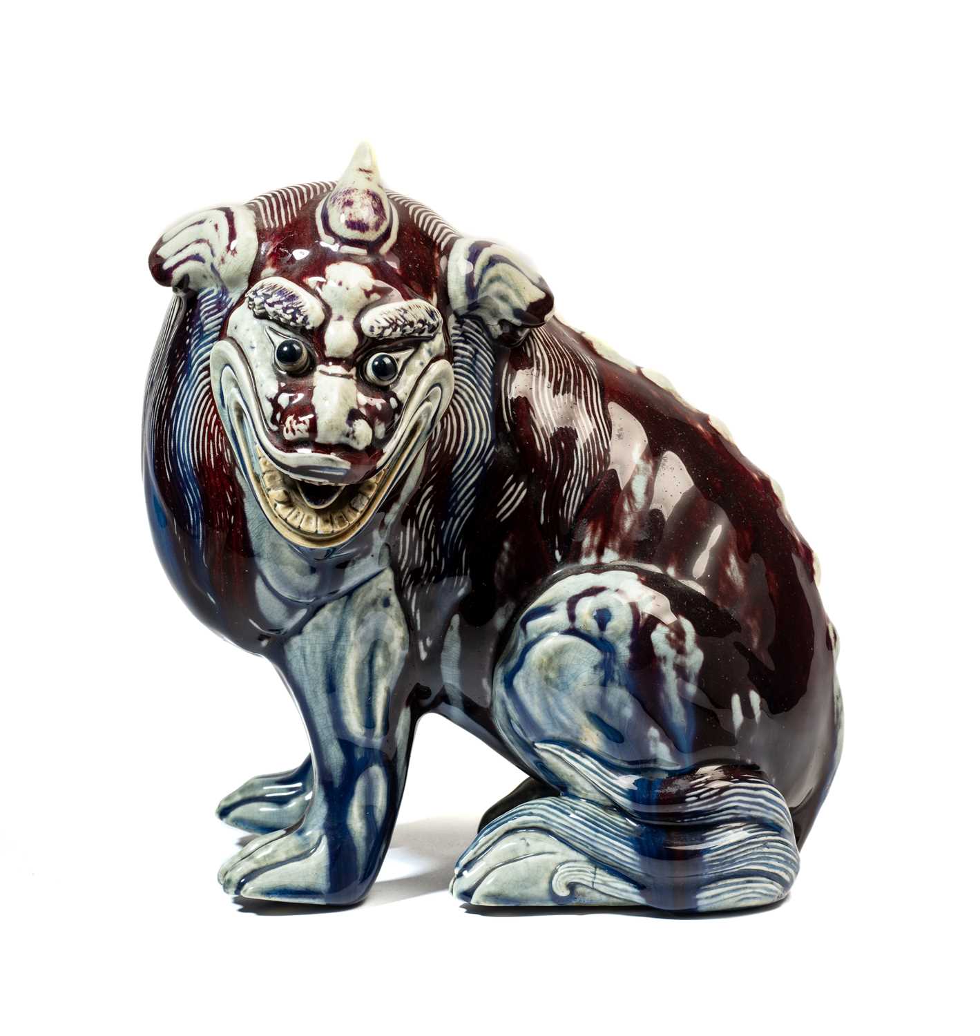 Lot 9 - A CHINESE FLAMBE-GLAZED MYTHICAL BEAST, QING