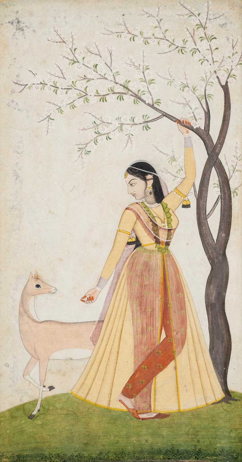 Lot 678 - A LADY WITH A DEER UNDER A BLOSSOMING TREE,
