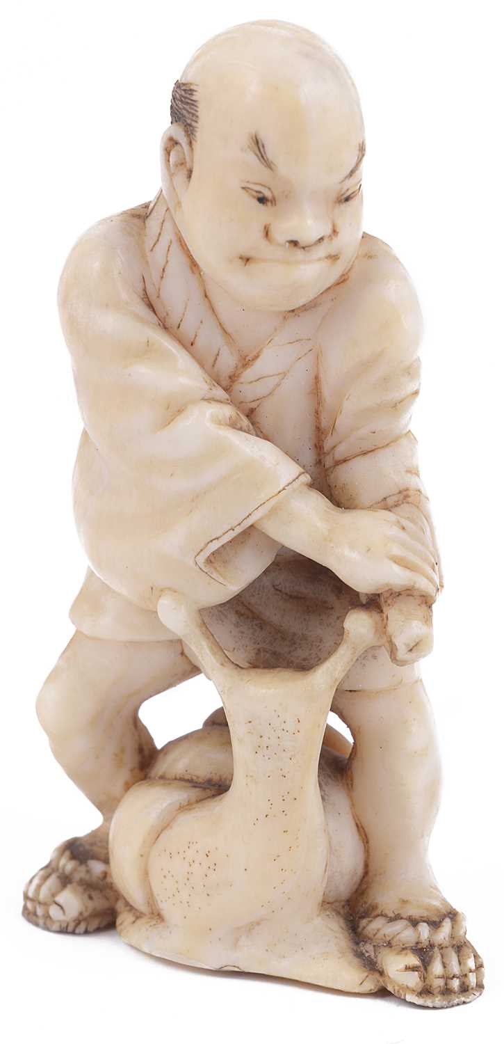 Lot 120 - ~IVORY NETSUKE OF A SAMURAI CONFRONTING A