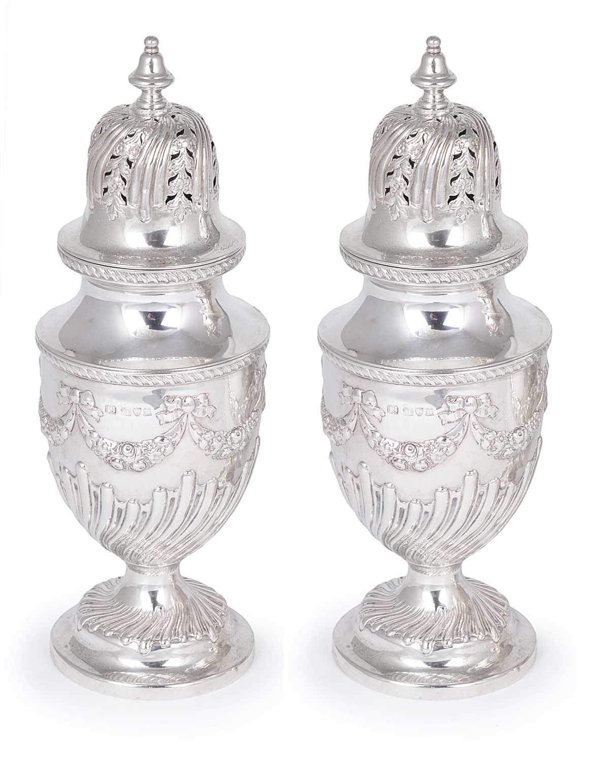 Lot 205 - A PAIR OF VICTORIAN SILVER CASTERS
