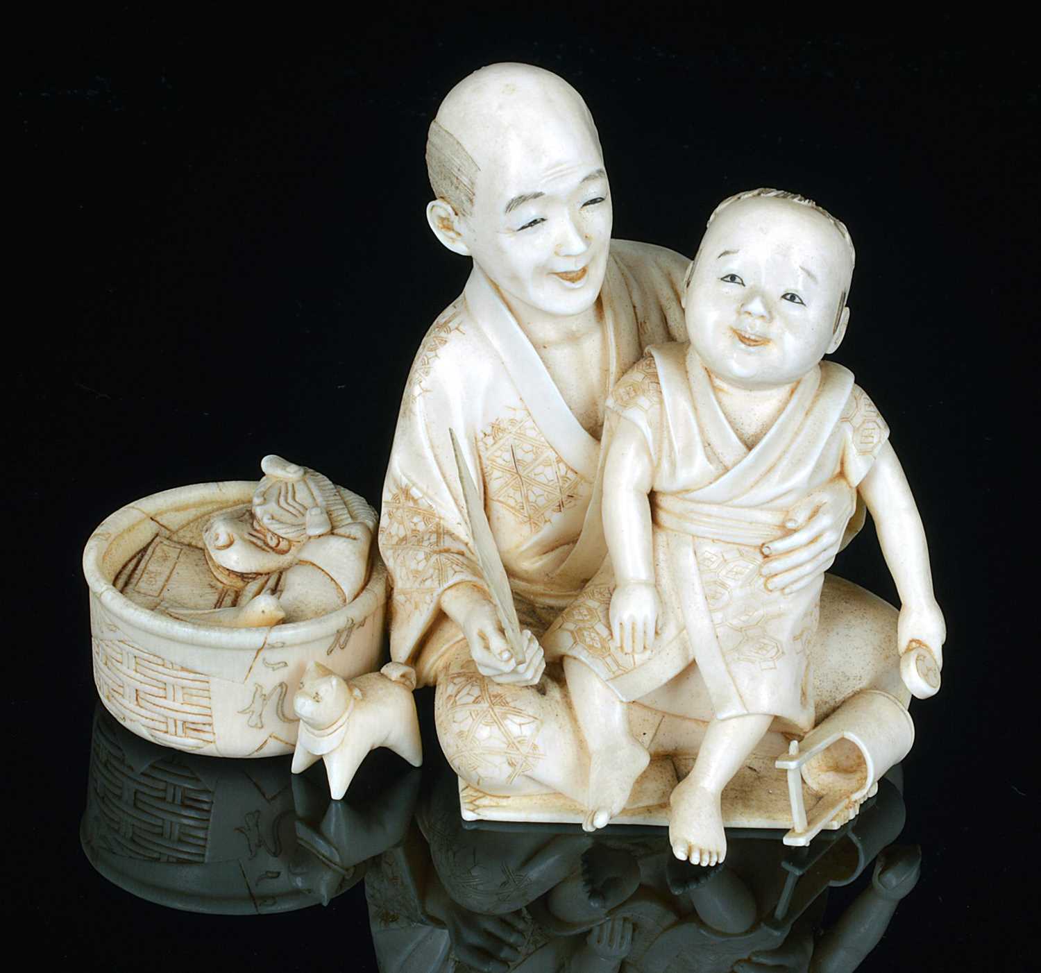 Lot 175 - A JAPANESE IVORY OKIMONO OF A TOY MAKER