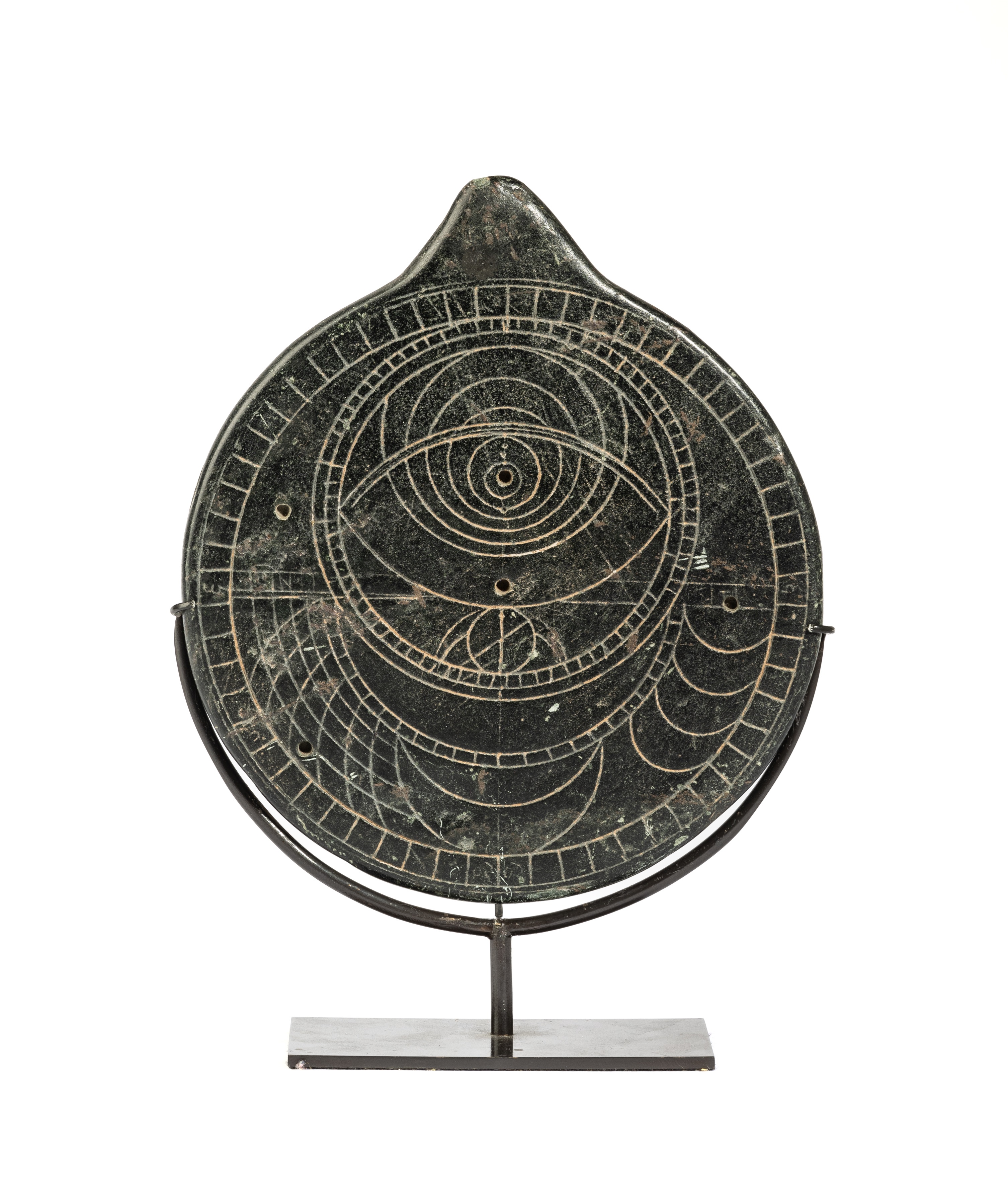 Lot 659 - A CARVED AND ENGRAVED BLACK STONE ASTROLABE,