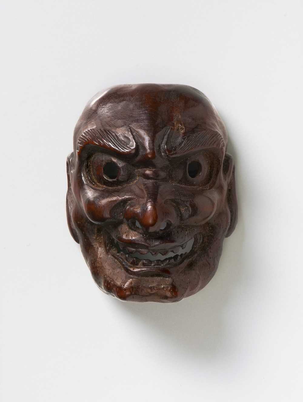 Lot 42 - A JAPANESE MASK NETSUKE OF SHISHIGUCHI