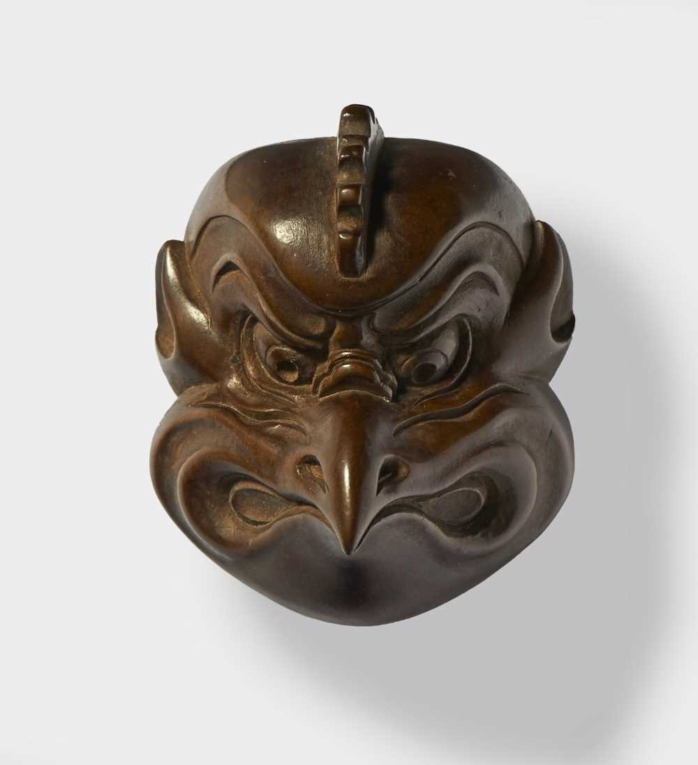 Lot 43 - A JAPANESE MASK NETSUKE OF KARASU-TENGU