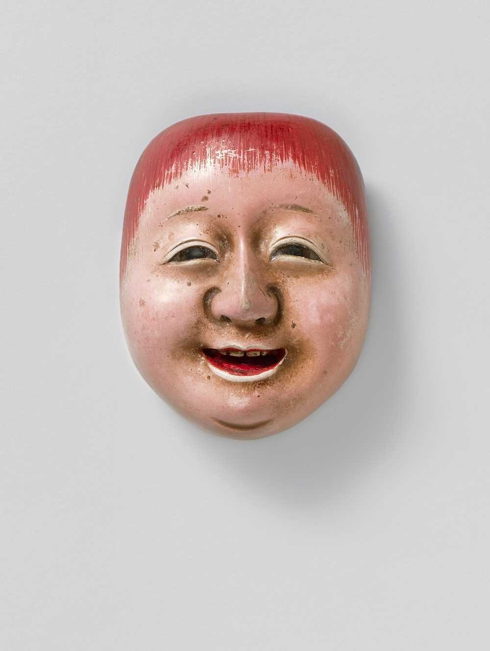Lot 68 - A JAPANESE MASK NETSUKE OF SHOJO