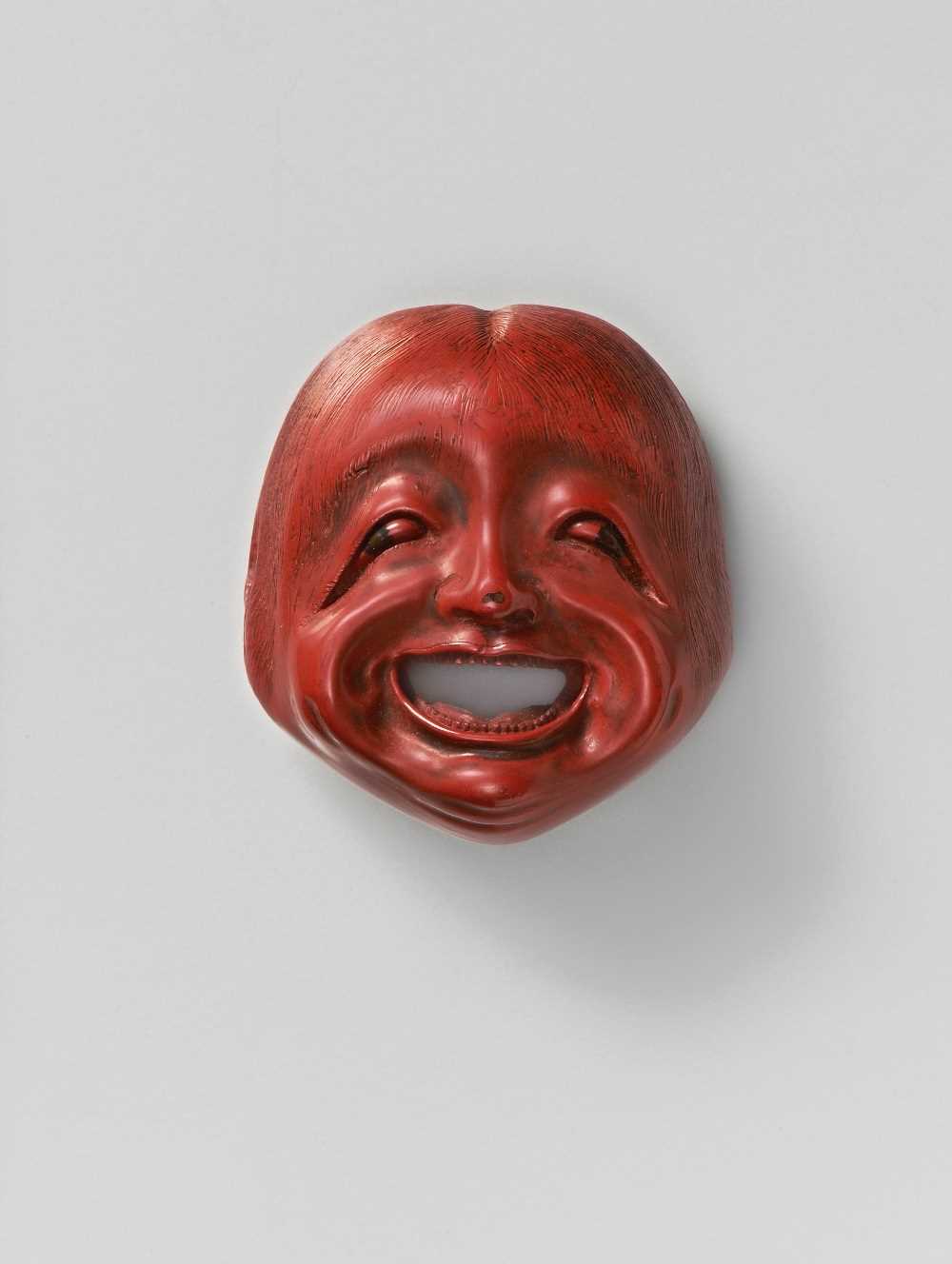 Lot 69 - A JAPANESE MASK NETSUKE OF SHOJO