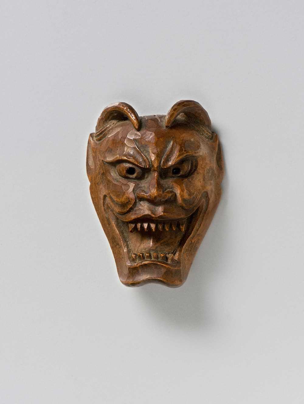 Lot 71 - A JAPANESE MASK NETSUKE OF NAMANARI