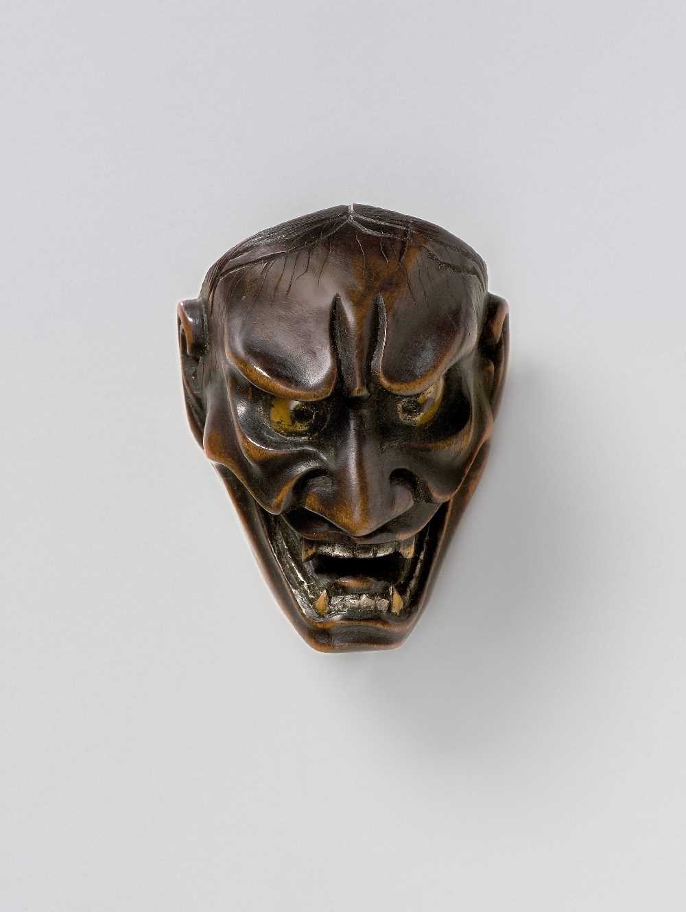 Lot 100 - A JAPANESE MASK NETSUKE OF SHIKAMI