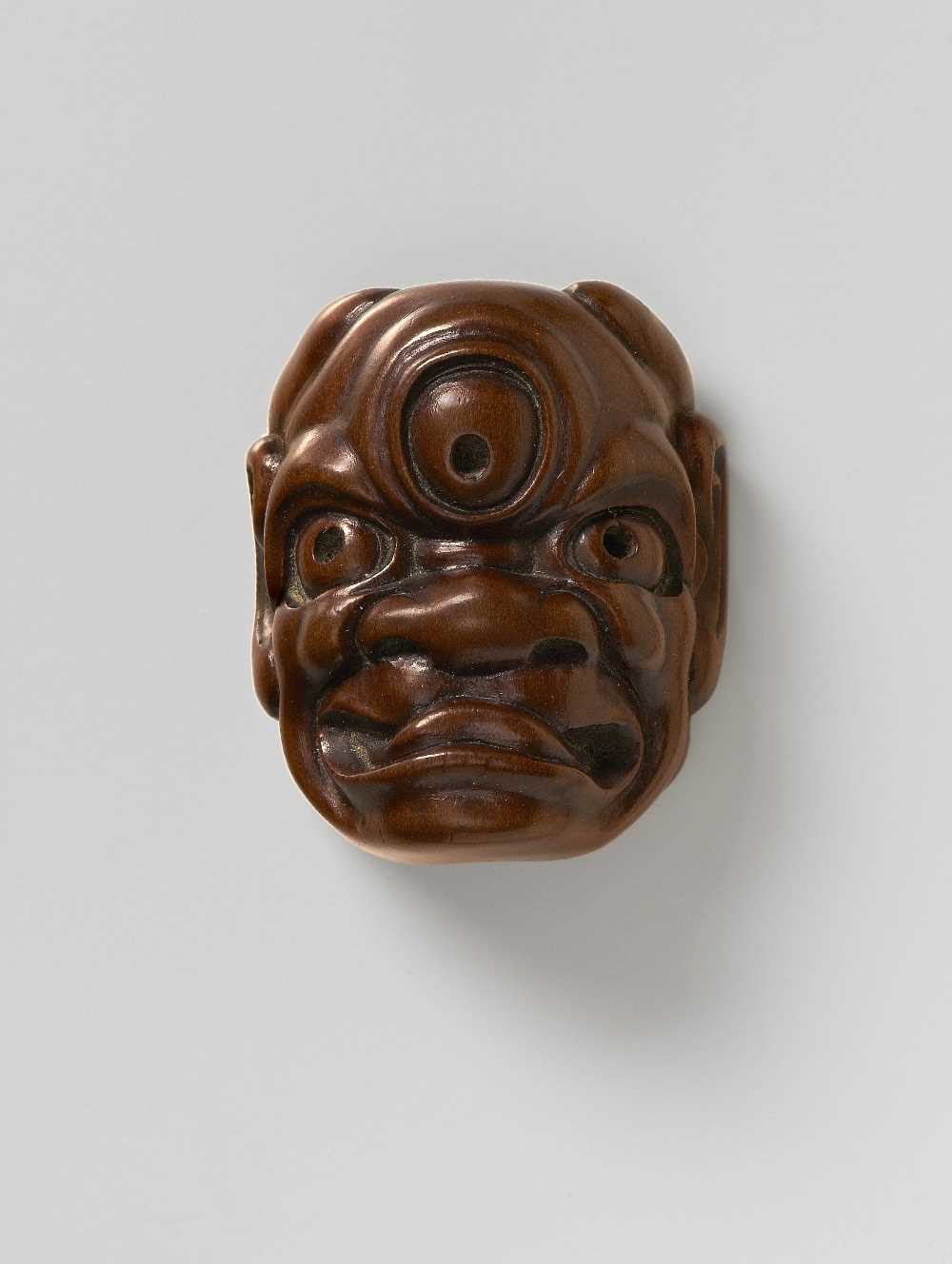 Lot 167 - A JAPANESE MASK NETSUKE OF BAKEMONO