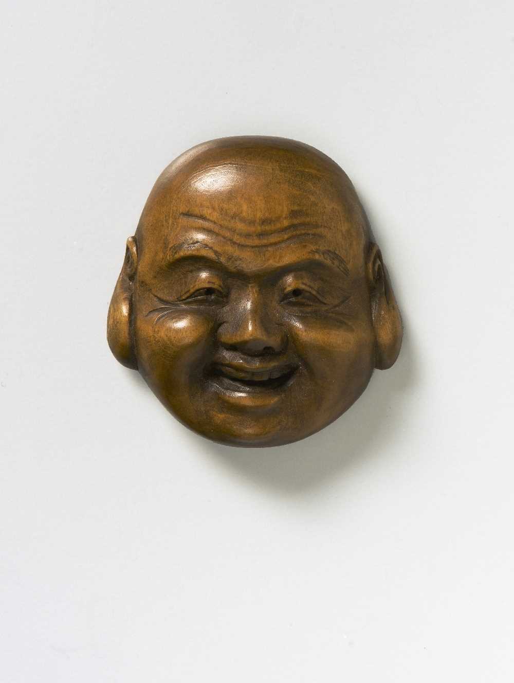 Lot 184 - A JAPANESE MASK NETSUKE OF HOTEI