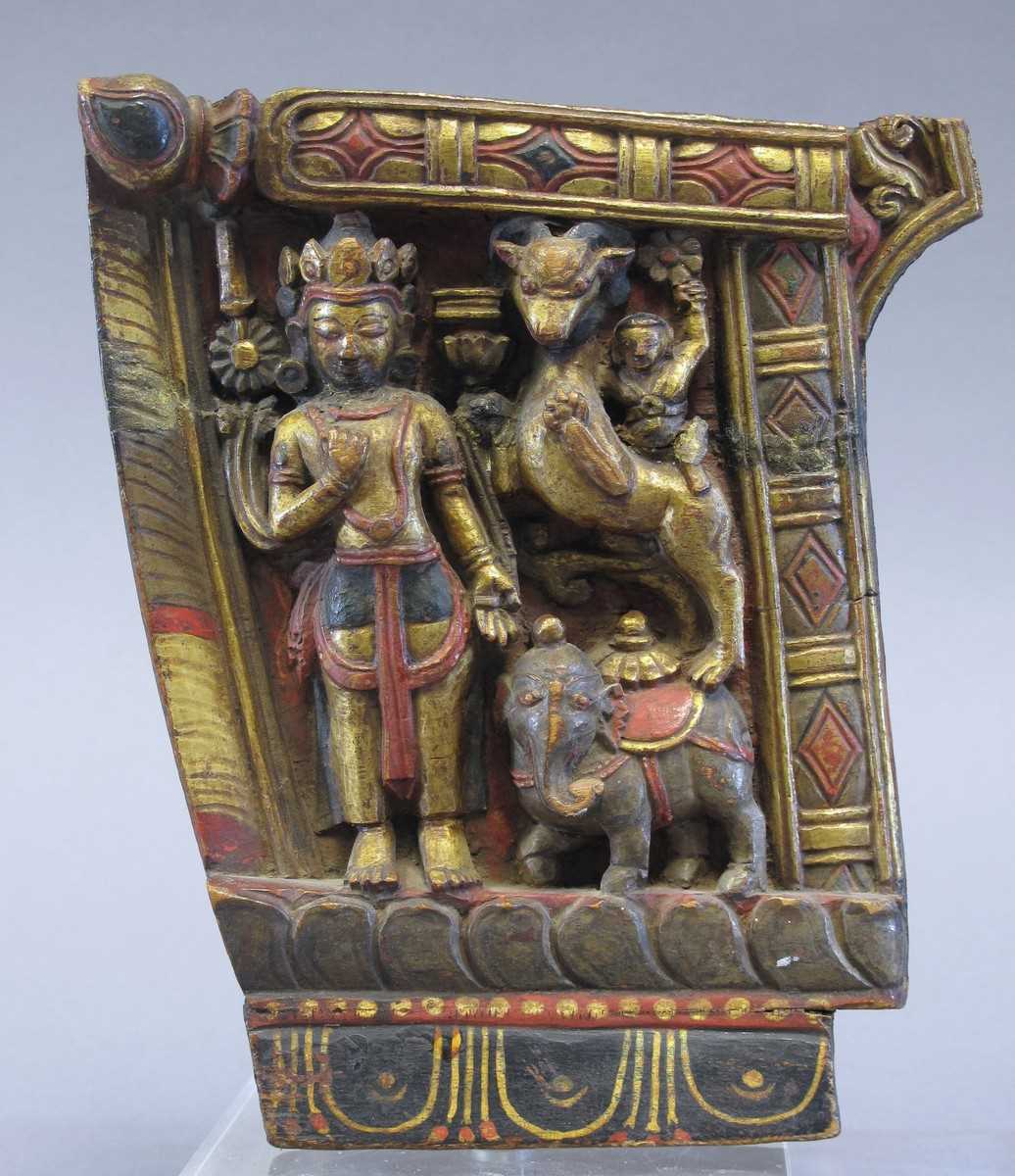 Lot 12 - A CARVED WOOD SECTION FROM A SHRINE