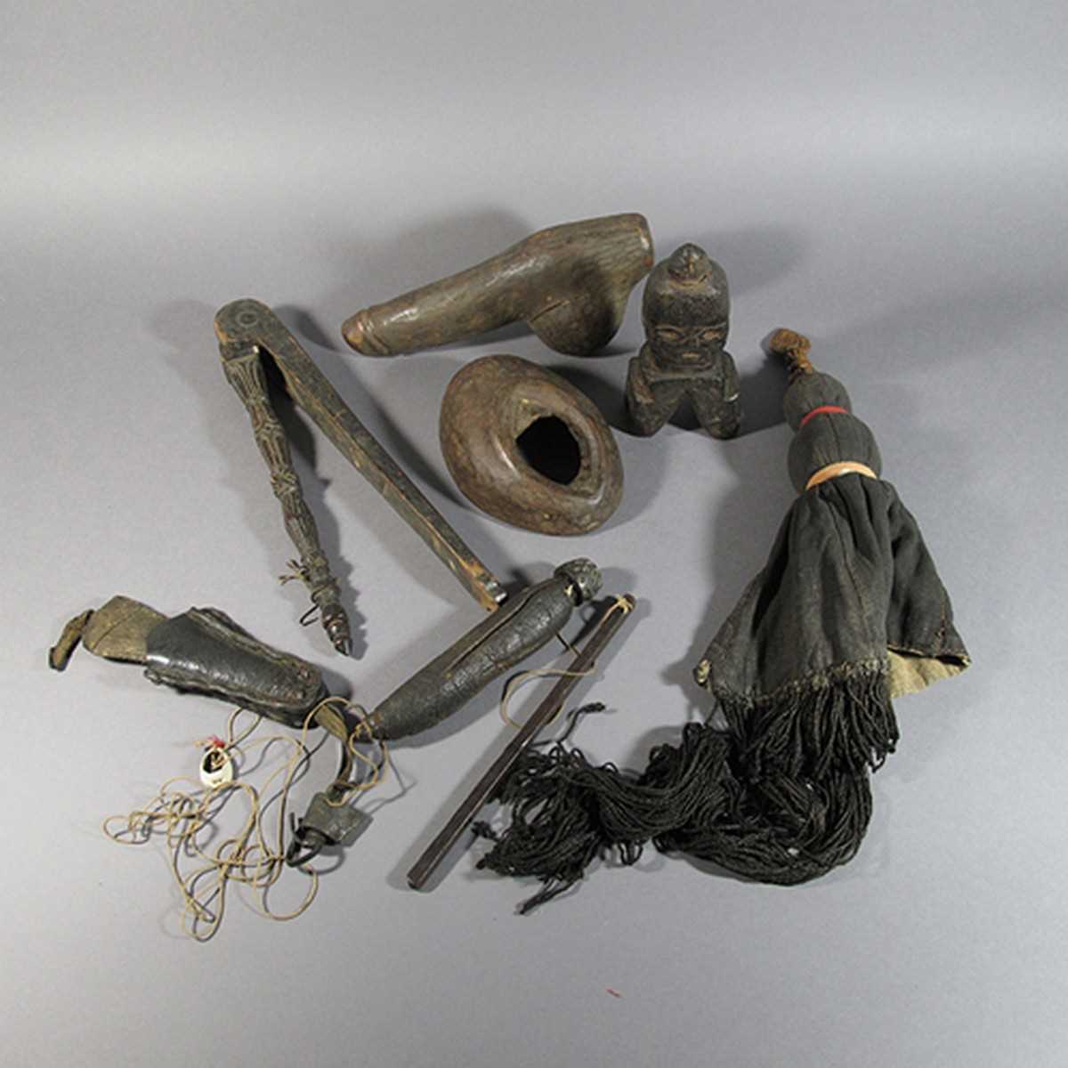 Lot 35 - SIX WOOD RITUAL OBJECTS