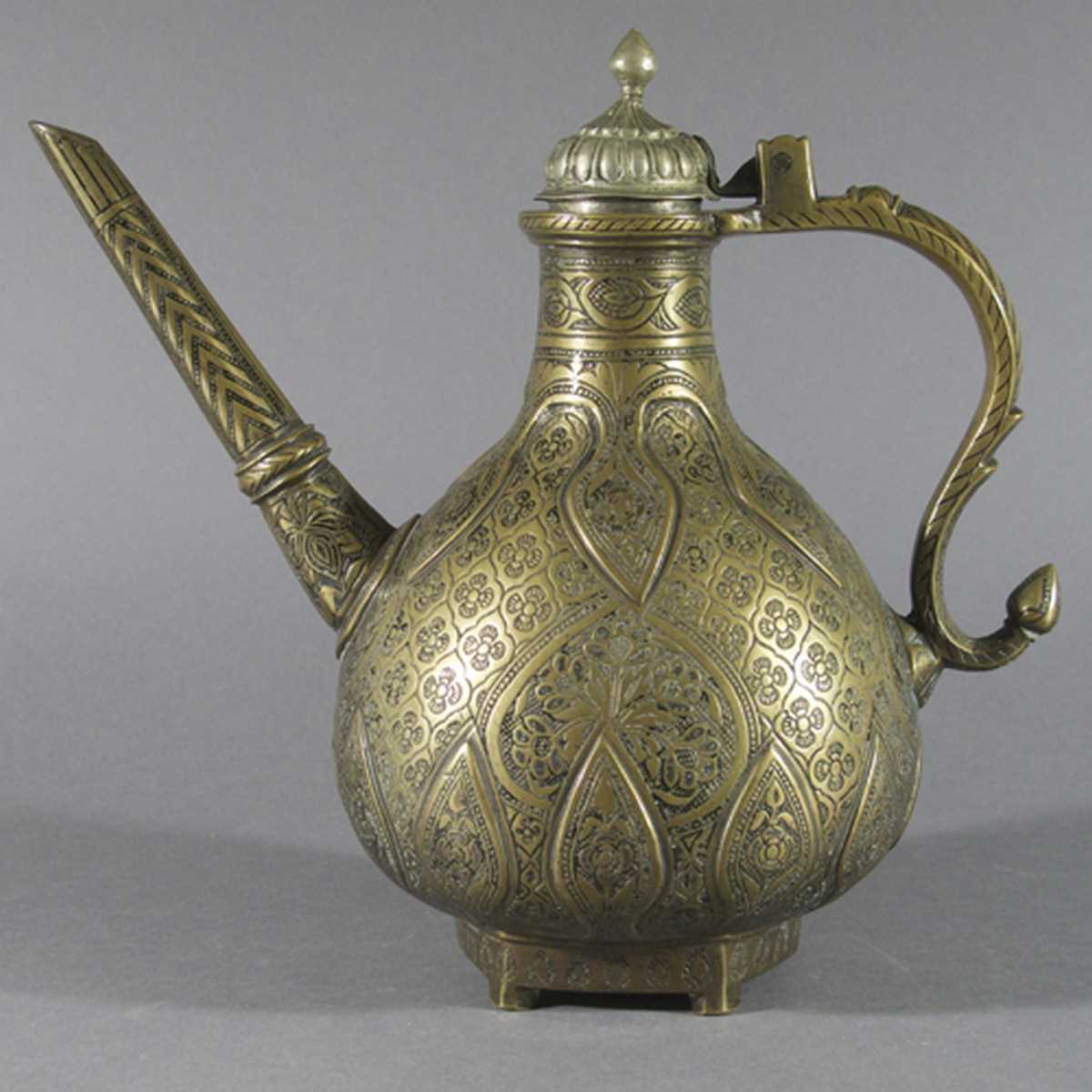 Lot 257 - A MUGHAL BRASS EWER