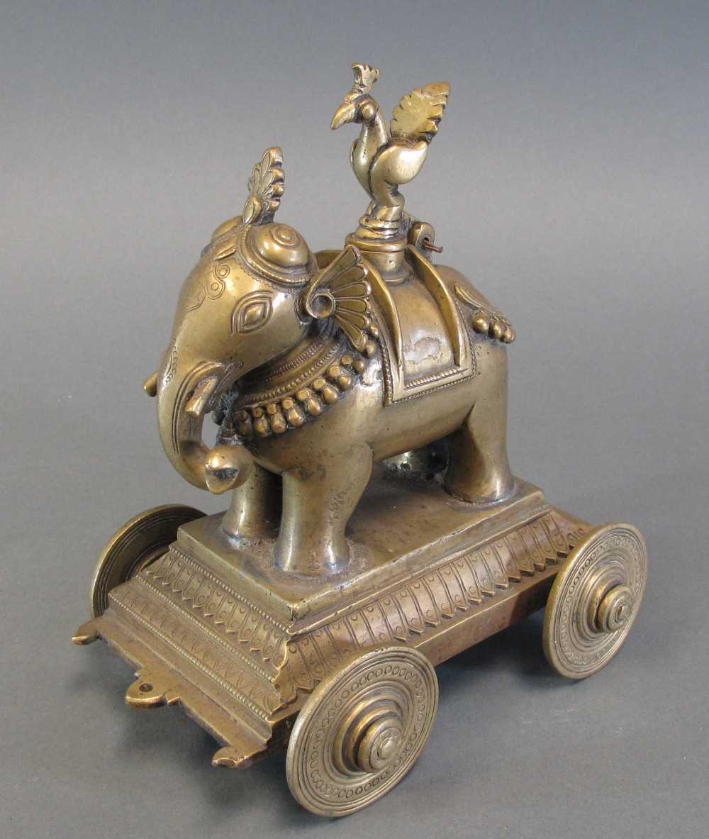 Lot 88 - A BRASS ELEPHANT ON WHEELS