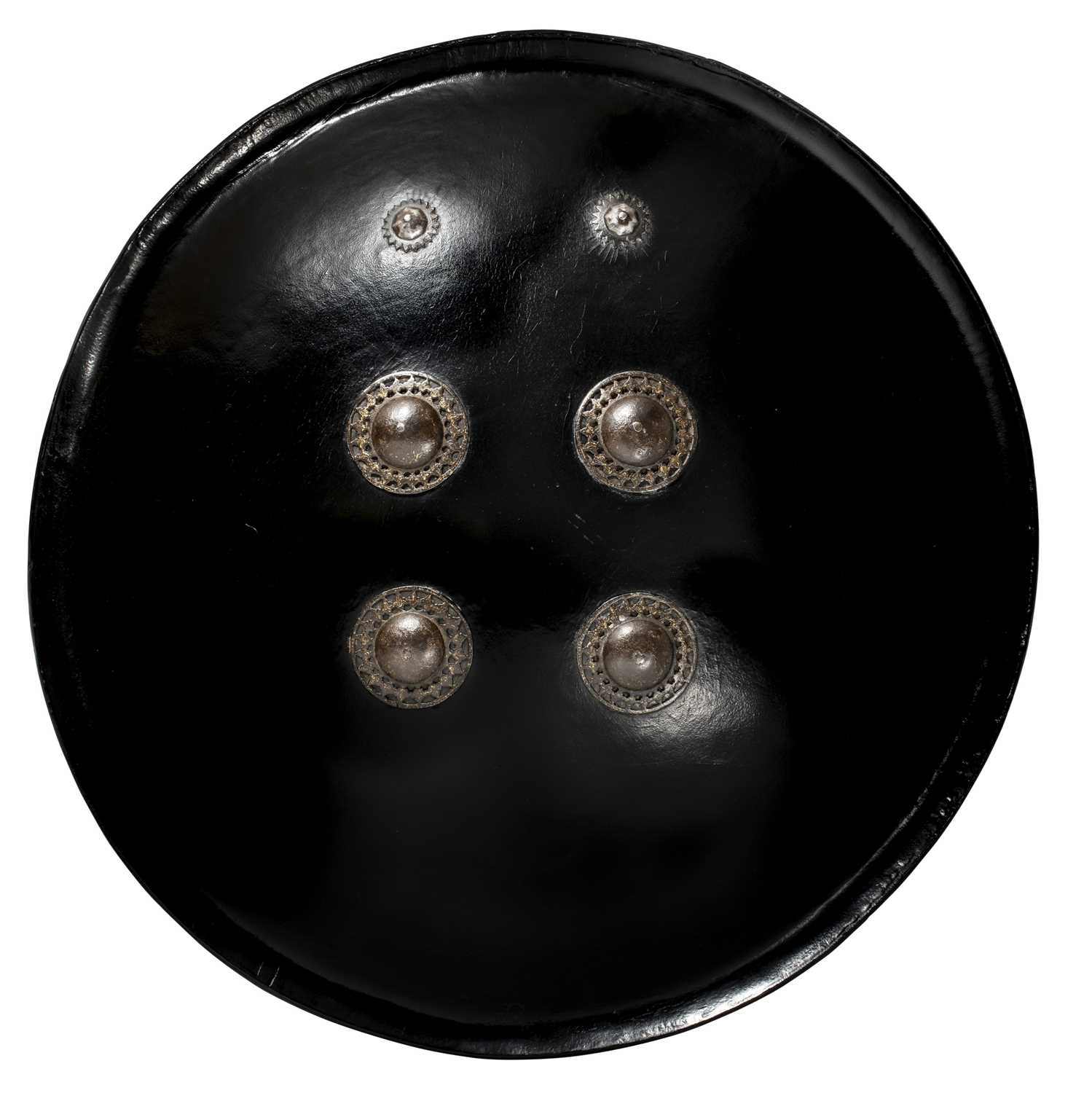 Lot 77 - AN INDIAN BLACK LACQUERED BUFFALO HIDE SHIELD