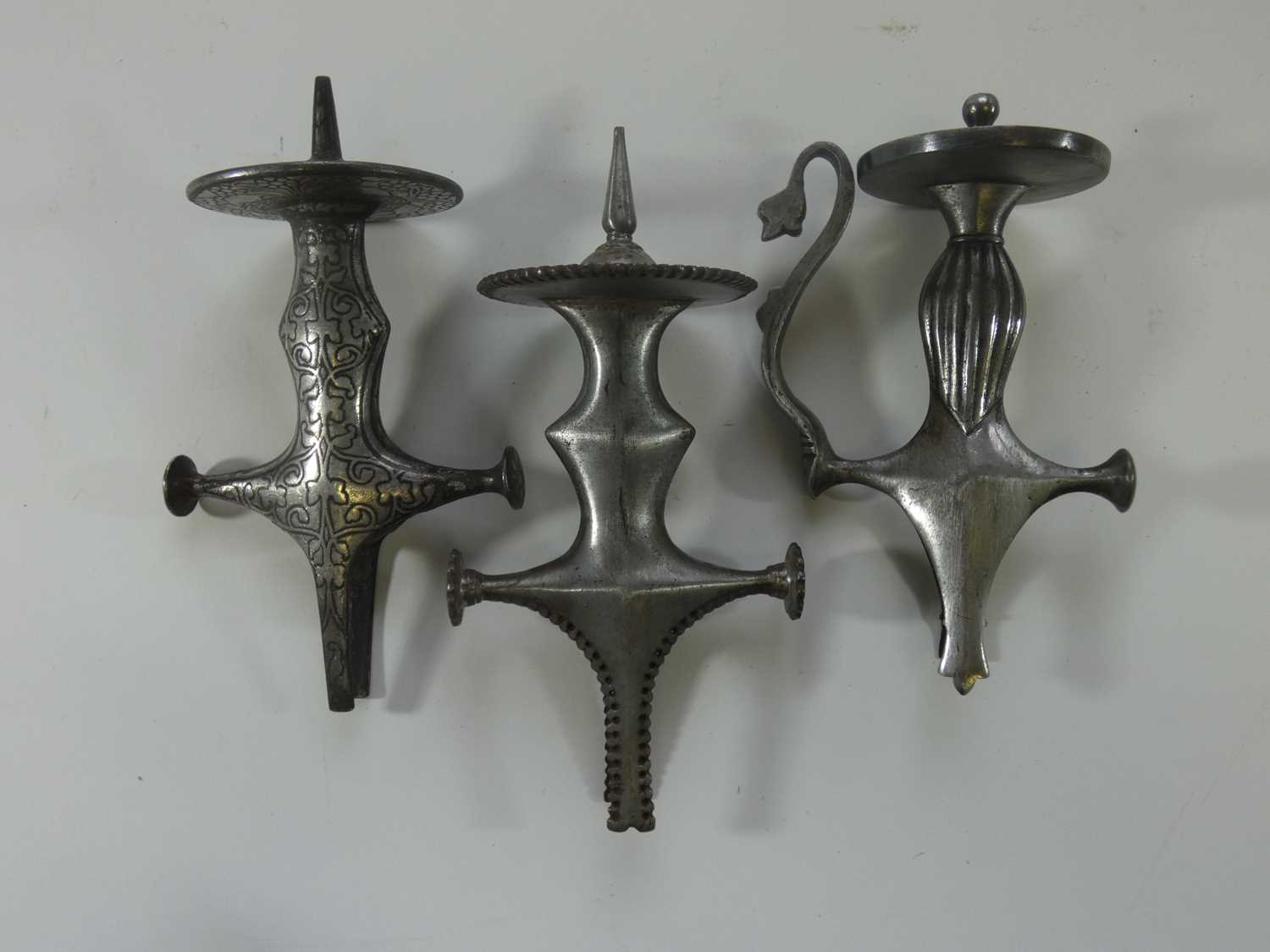 Lot 150 - THREE INDIAN SWORD (TALWAR) HILTS, 19TH