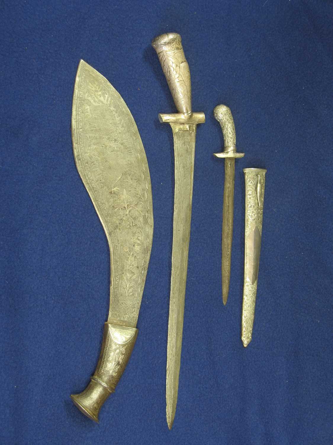 Lot 12 - TWO SOUTH EAST ASIAN DAGGERS AND A NEPALESE