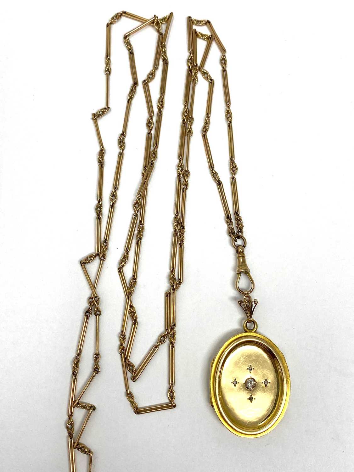 Lot 495 - GOLD LONG CHAIN AND DIAMOND LOCKET, 1890s