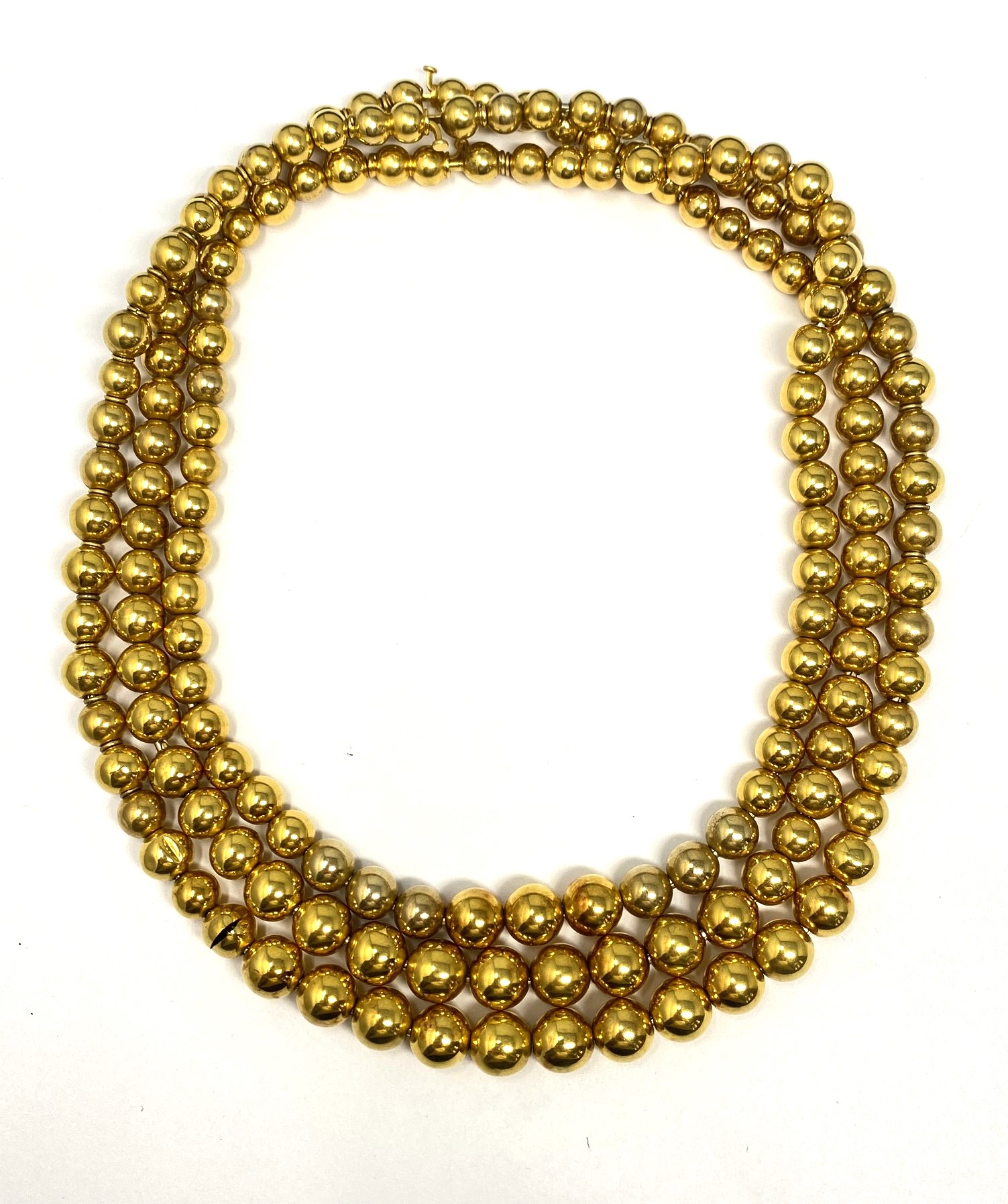 Lot 493 - THREE GOLD BEADED NECKLACES