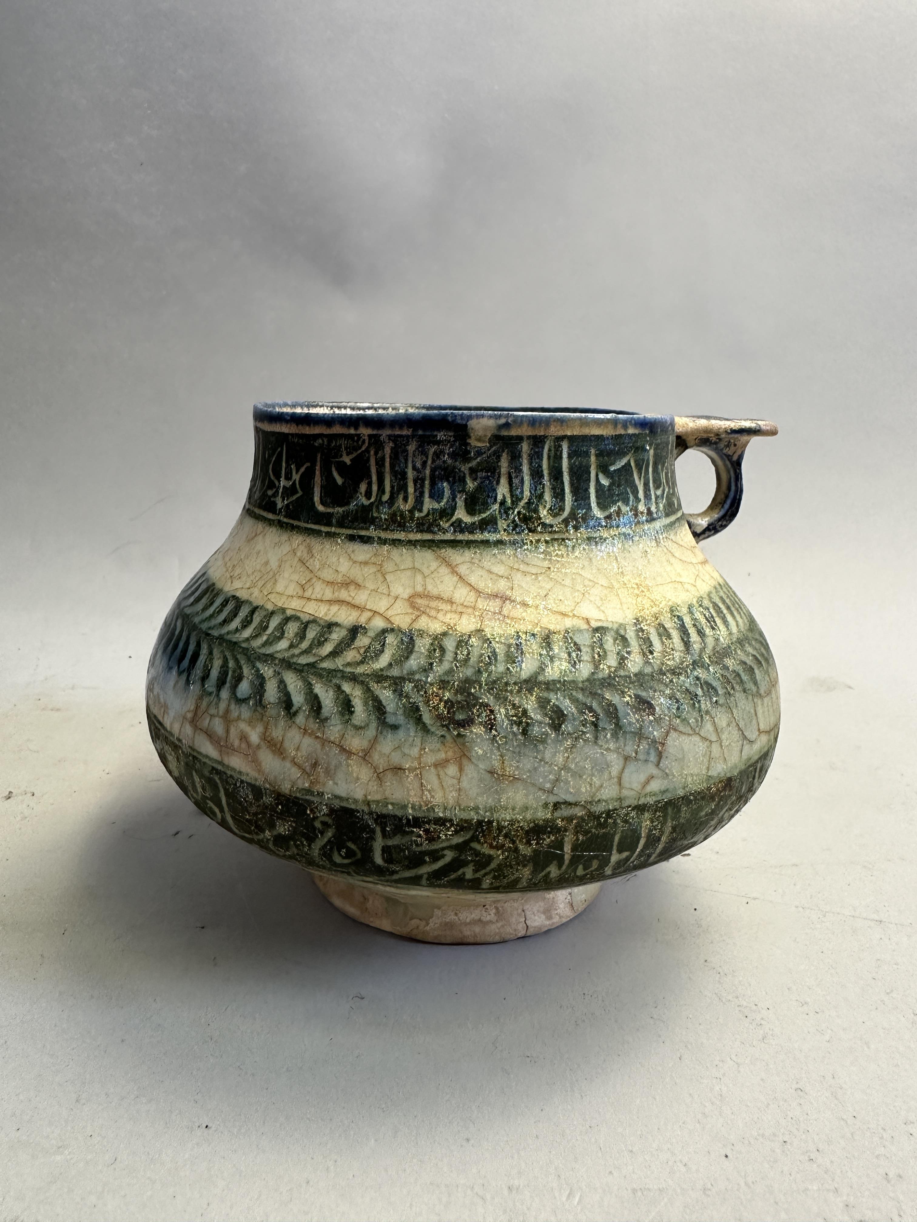 Lot 48 - A KASHAN POTTERY JUG, PERSIA, 13TH CENTURY