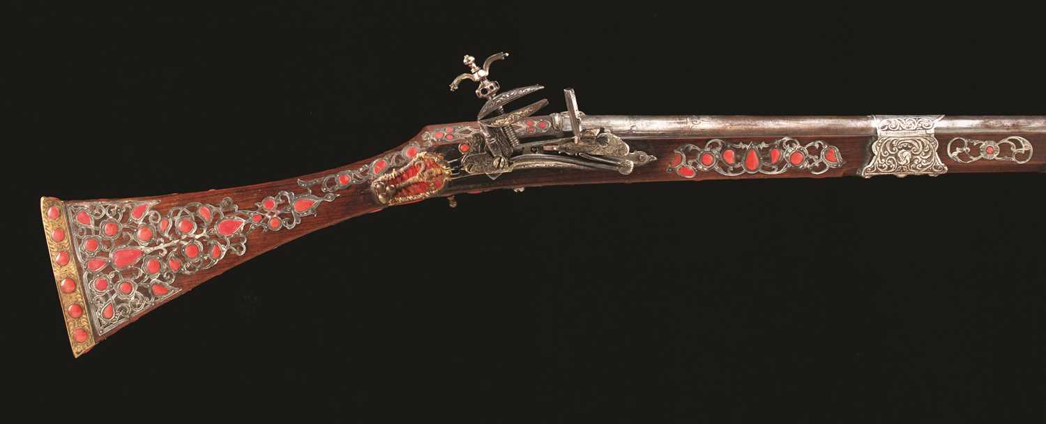 Lot 43 - AN ALGERIAN SILVER-MOUNTED TOE-LOCK MUSKET