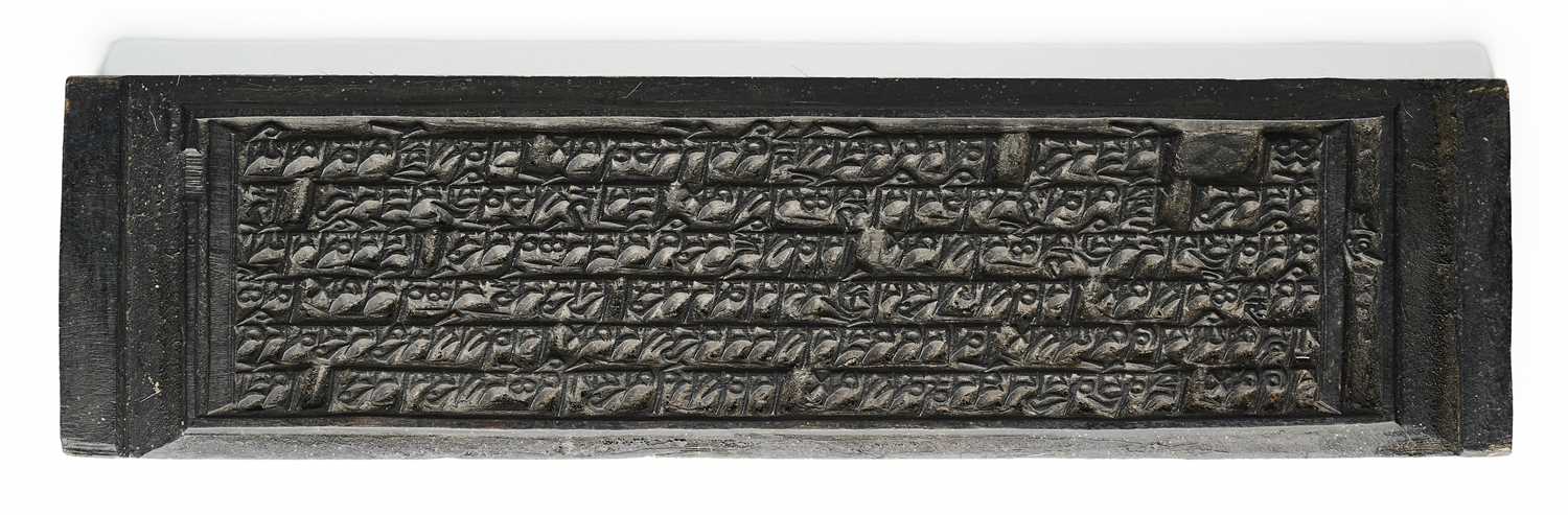 Lot 141 - A CARVED WOOD PRINTING BLOCK, TIBET, CIRCA