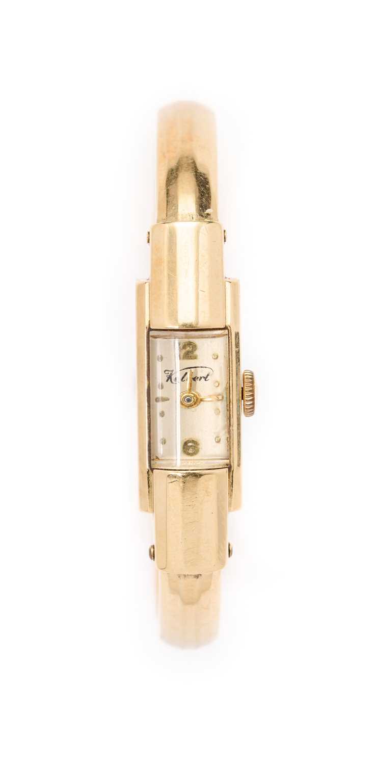 Lot 305 - KELBERT WATCH CO.: A GOLD BANGLE WATCH,