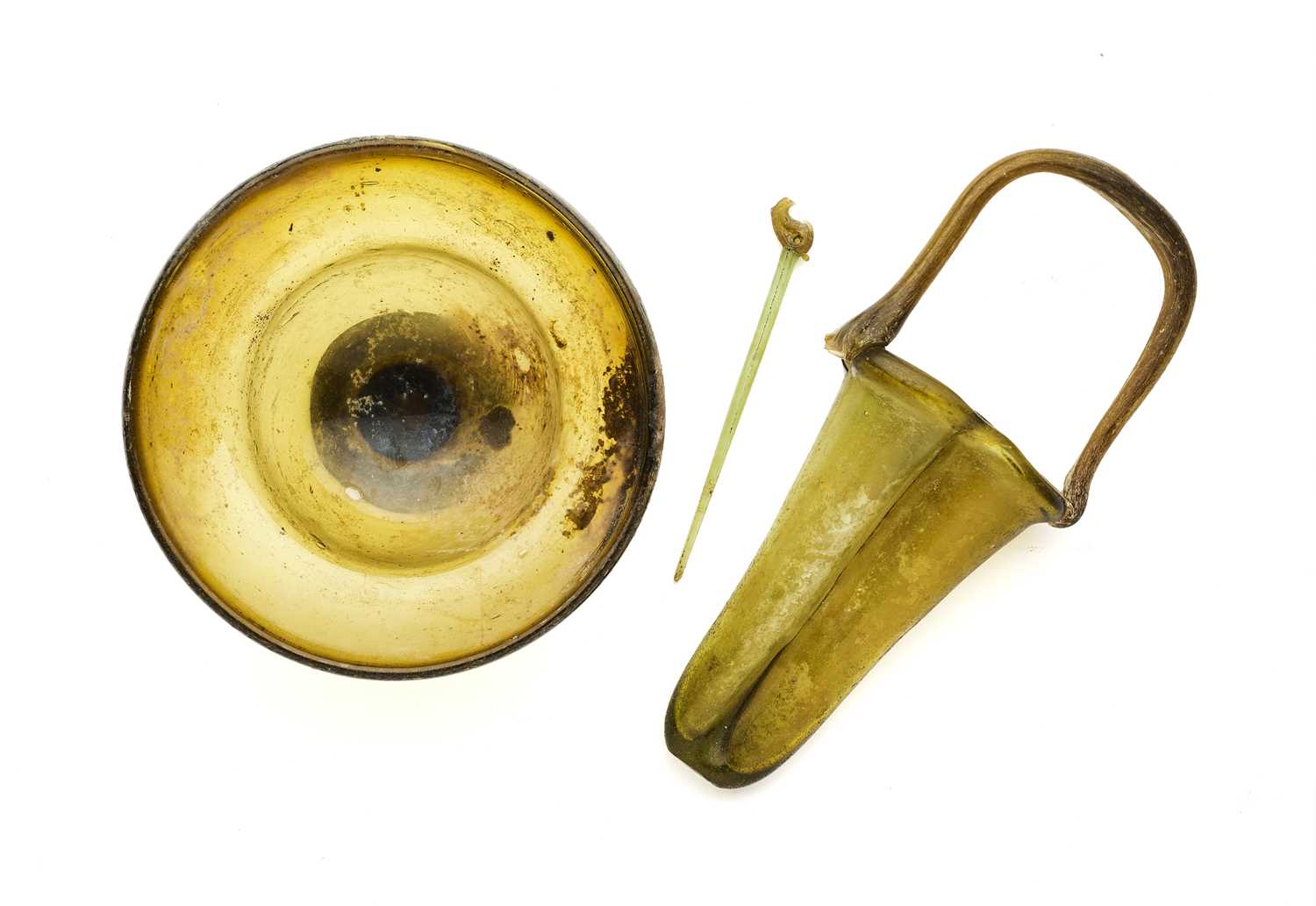 Lot 57 - TWO ROMAN AMBER GLASS VESSELS, CIRCA 3RD-4TH