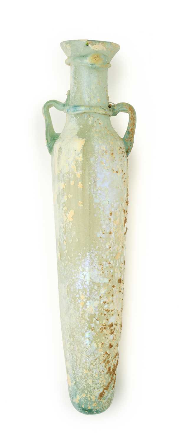 Lot 225 - A ROMAN PALE GREEN ELONGATED GLASS FLASK,