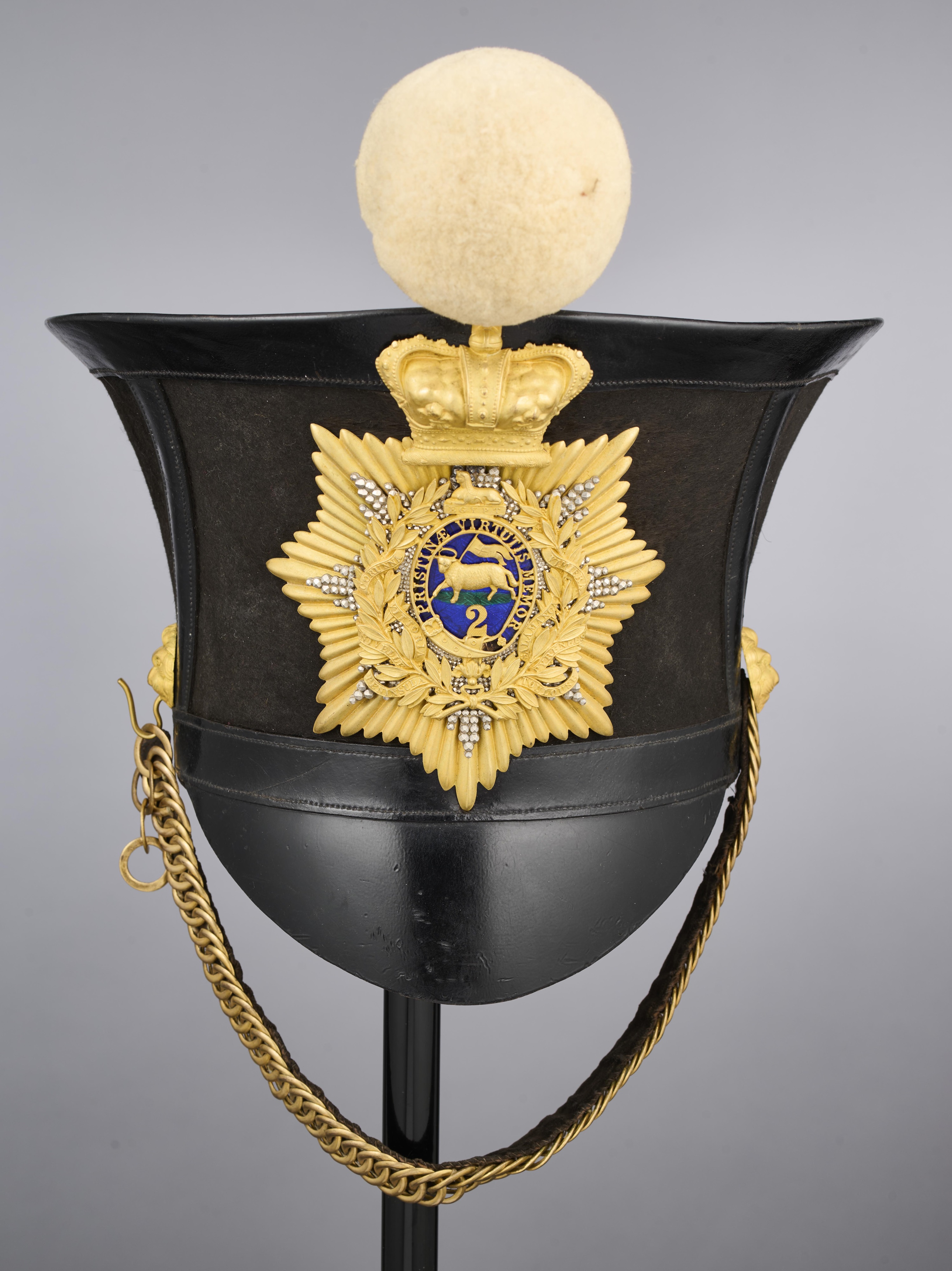 Lot 244 - AN OFFICER’S SHAKO OF THE QUEEN’S REGIMENT,