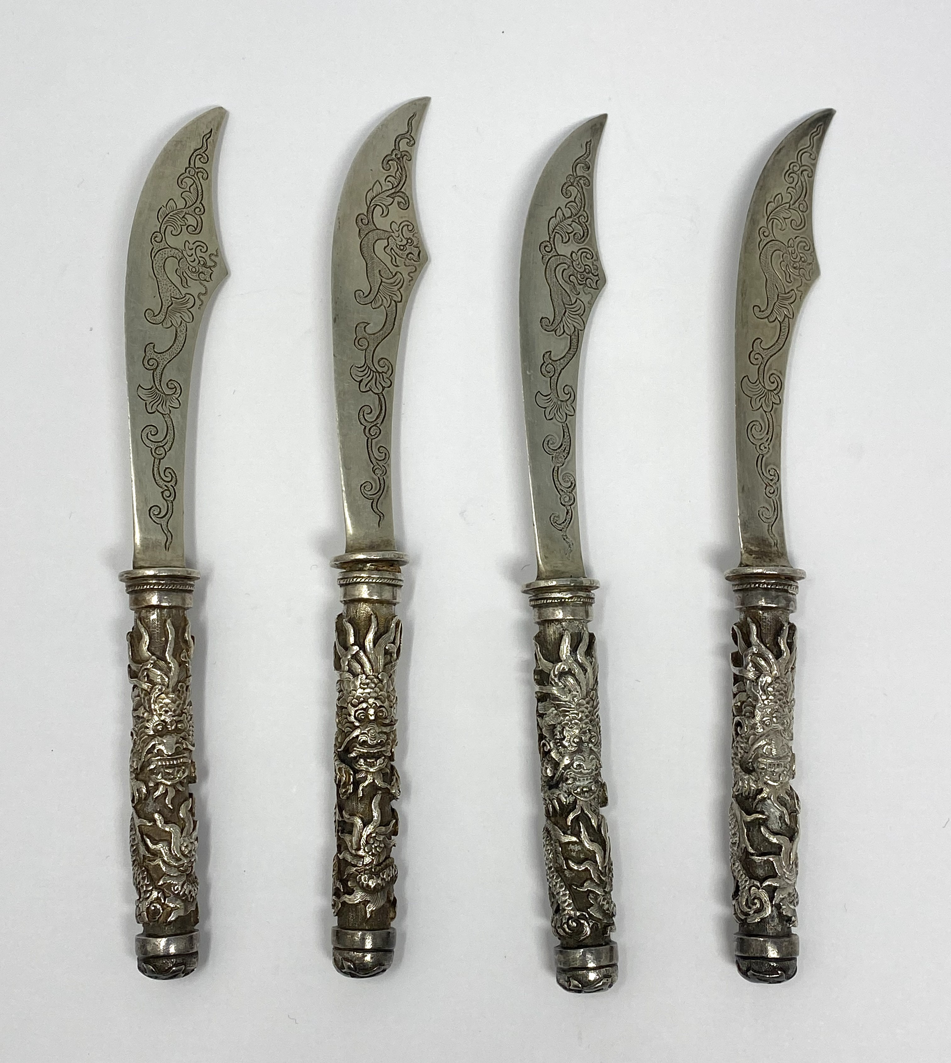 Lot 132 - A SET OF FOUR CHINESE SILVER KNIVES,