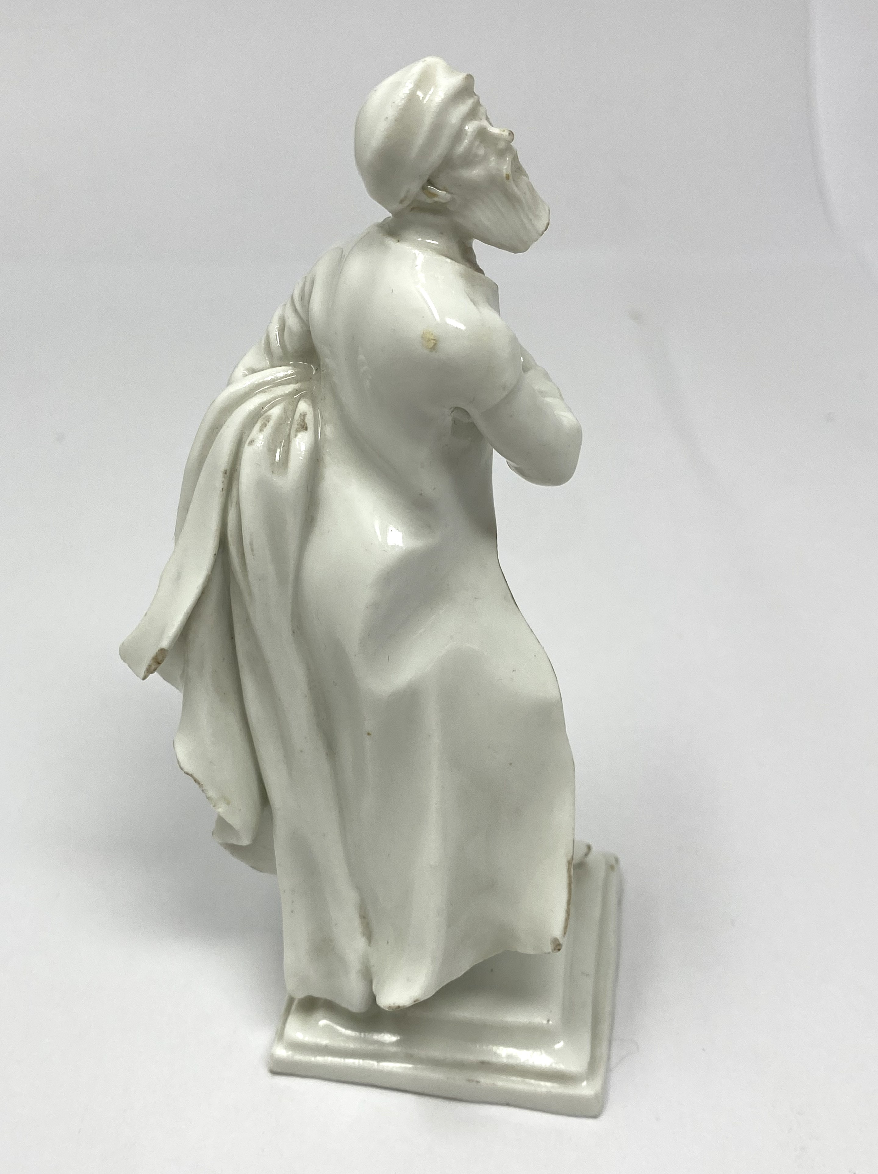 Lot 7 - A VIENNA 'PANTALONE' PORCELAIN FIGURE, CIRCA
