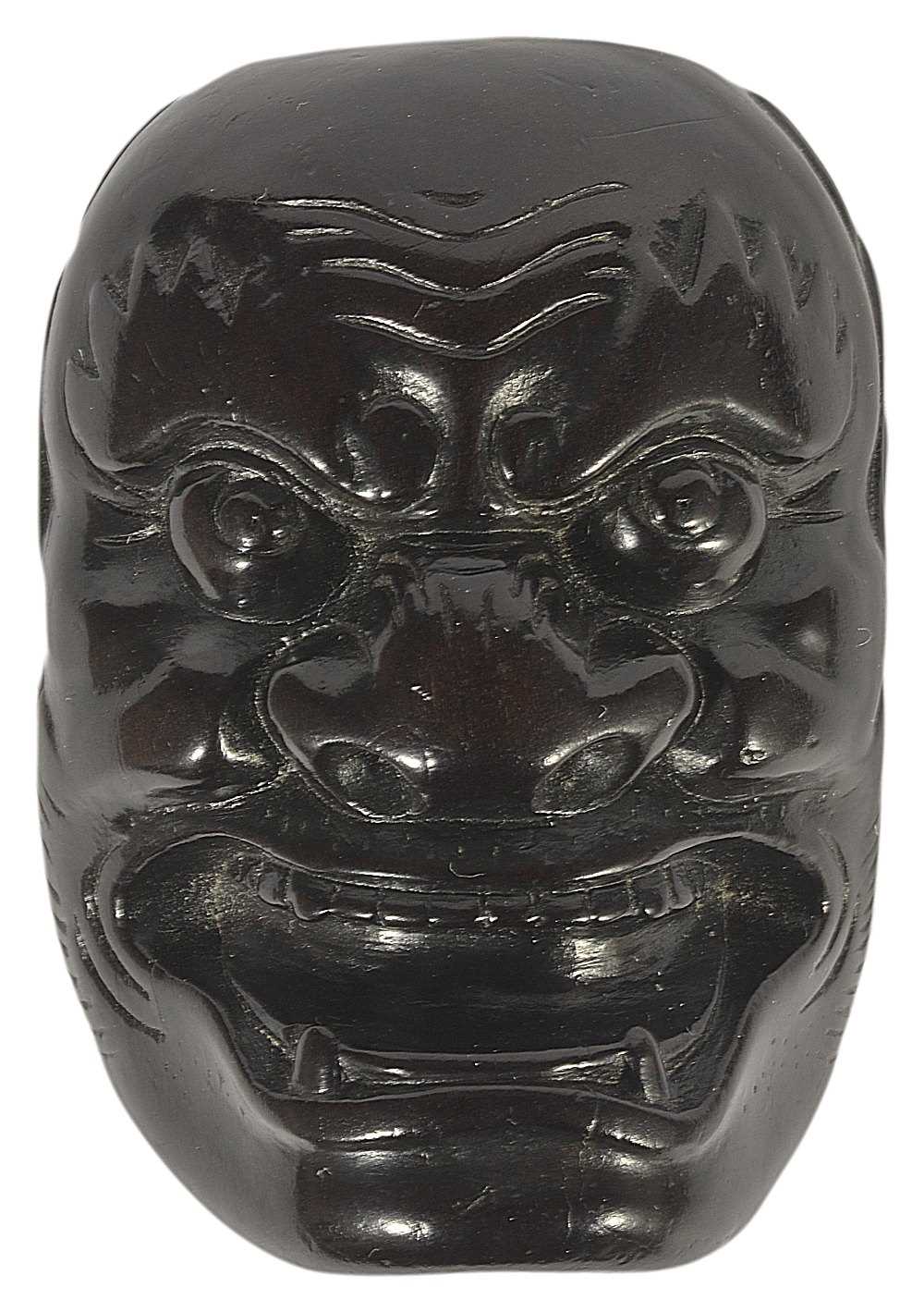 Lot 372 - ~A JAPANESE EBONY MASK NETSUKE OF A FIERCE