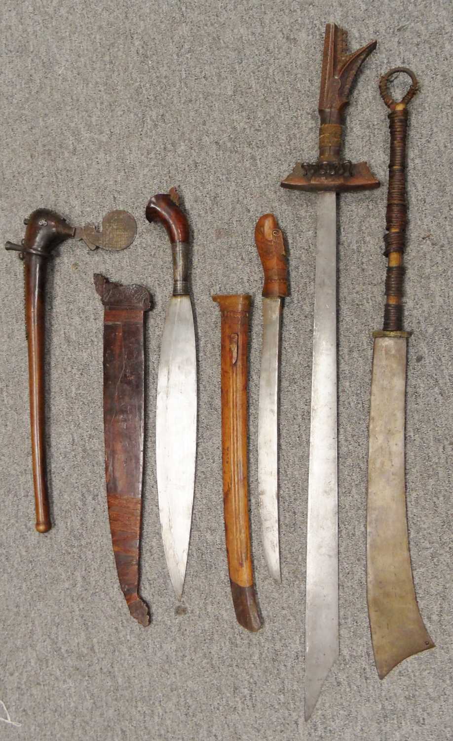 Lot 35 - â€¡ FOUR SOUTH EAST ASIAN EDGED WEAPONS AND A