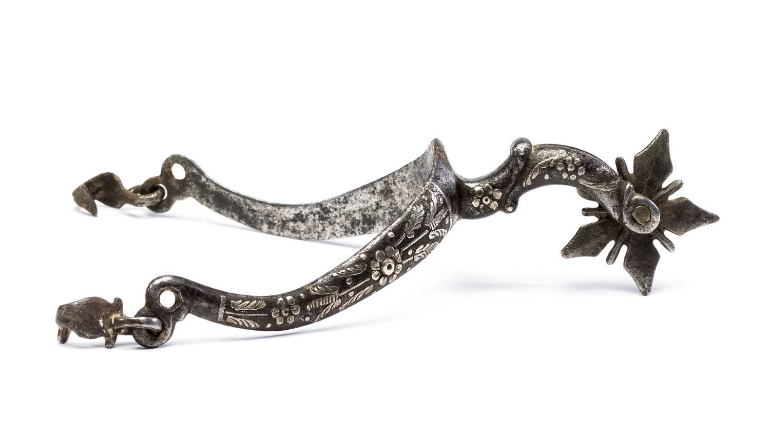 Lot 278 - A SILVER-ENCRUSTED ROWEL SPUR